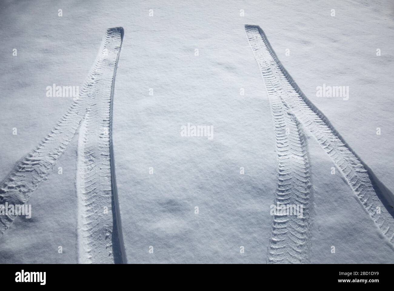 Car tire tracks ending on snow , Finland Stock Photo - Alamy