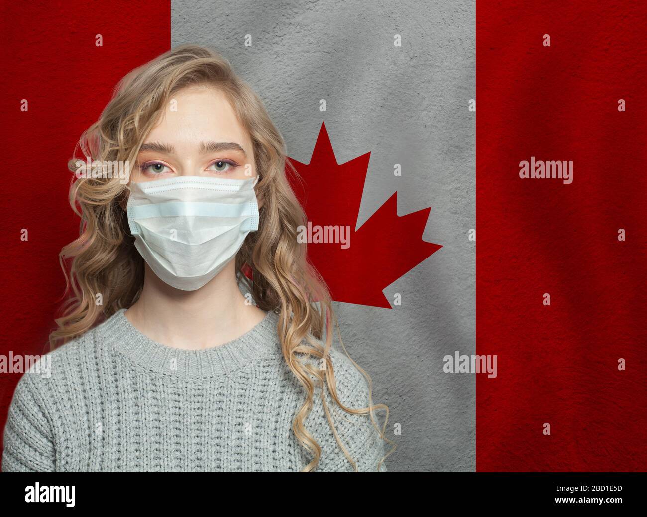 Young woman wearing a face mask with national flag Canada. Flu epidemic ...