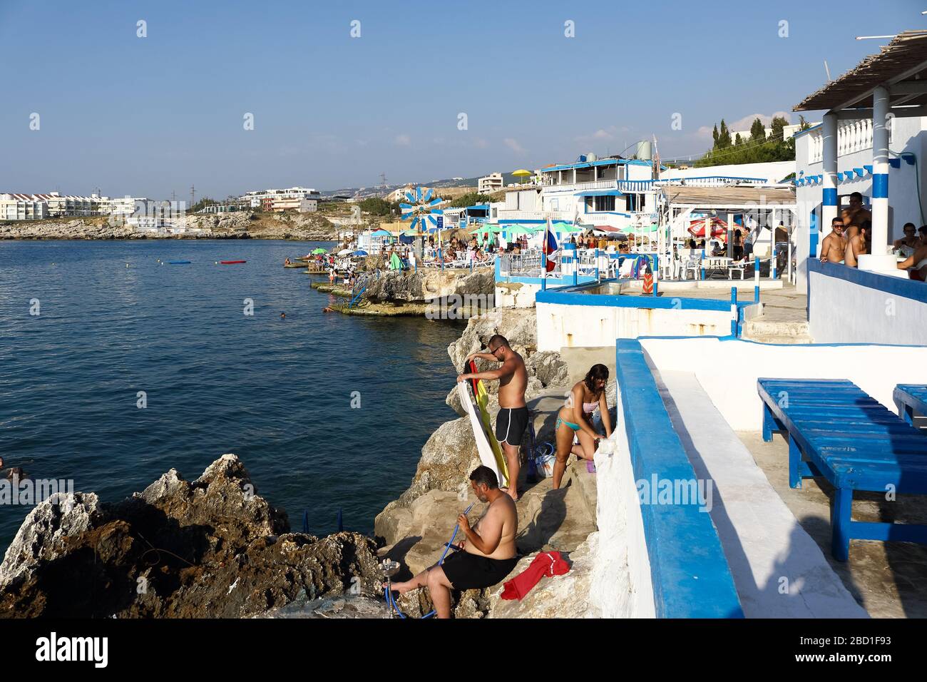 Chekka, Lebanon - June 4, 2017: Several tourists relaxing at the beach ...