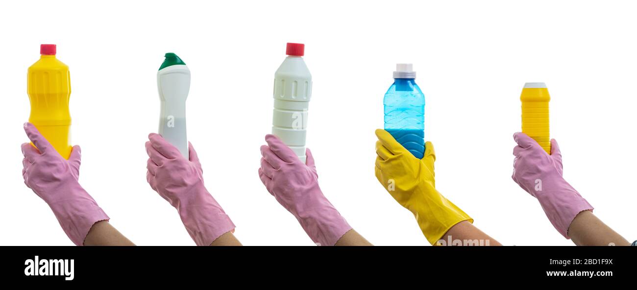 Cleaning, hand holding detergent bottles isolated against white ...