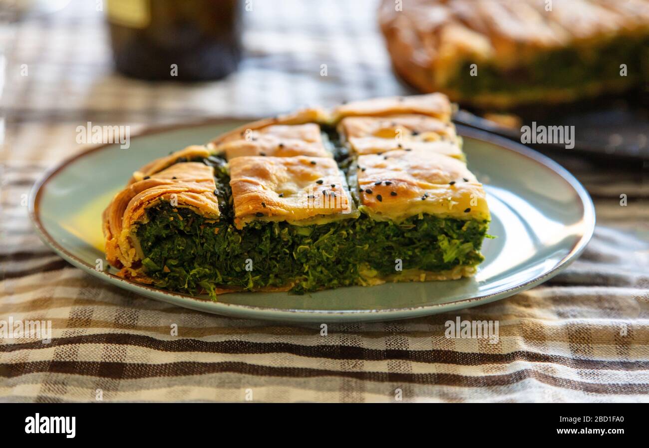 Healthy food concept. Spinach pie or greek spanakopita serving on ...
