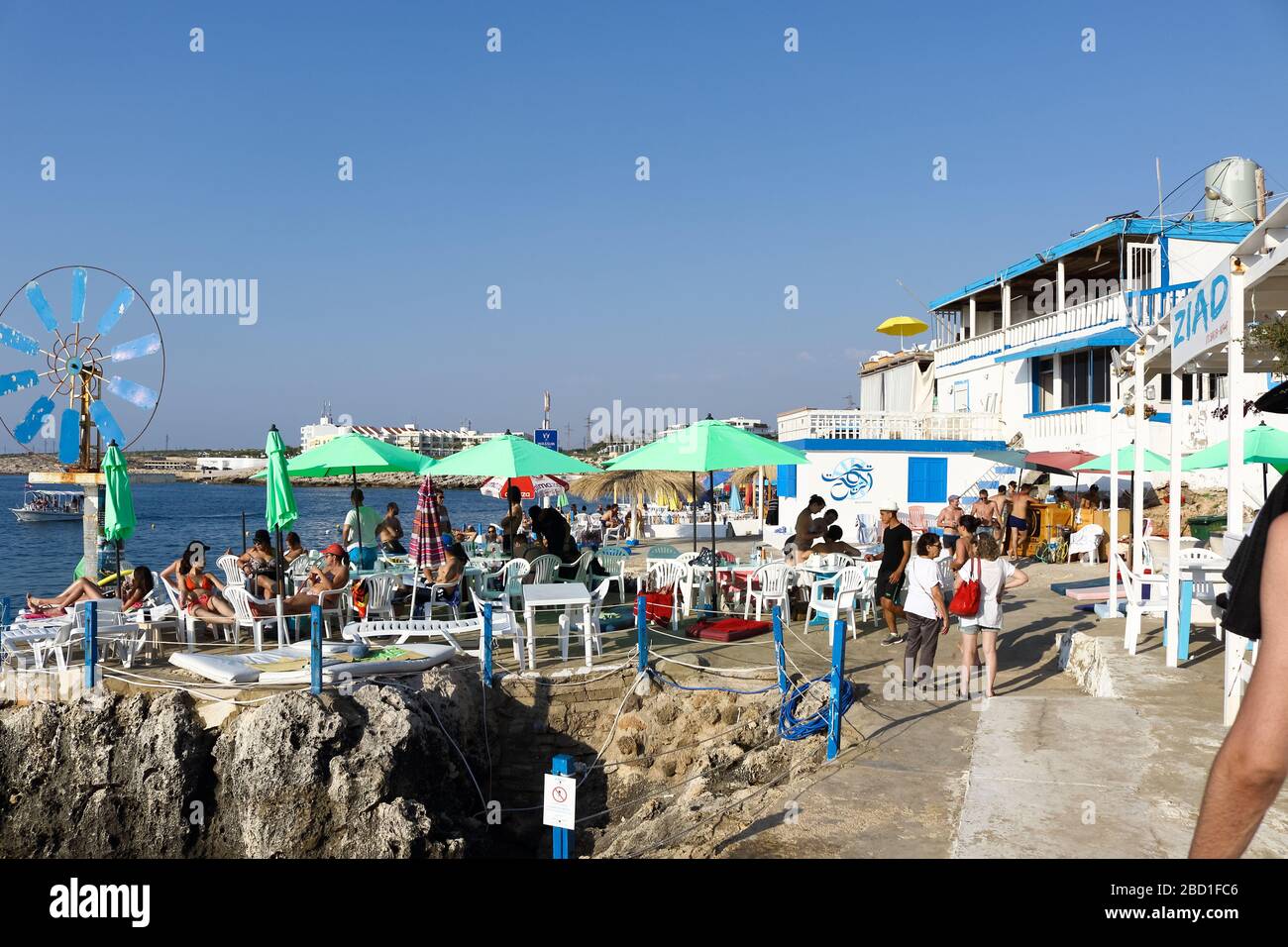 Chekka, Lebanon - June 4, 2017: Several tourists relaxing at the beach ...