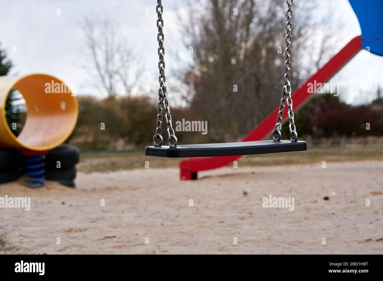 Blue and yellow swing set hi-res stock photography and images - Alamy