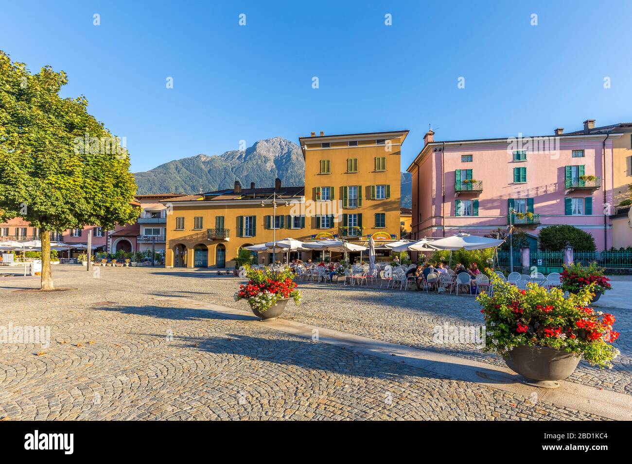Colourful square of the village of Colico in the summer, Lake Como ...