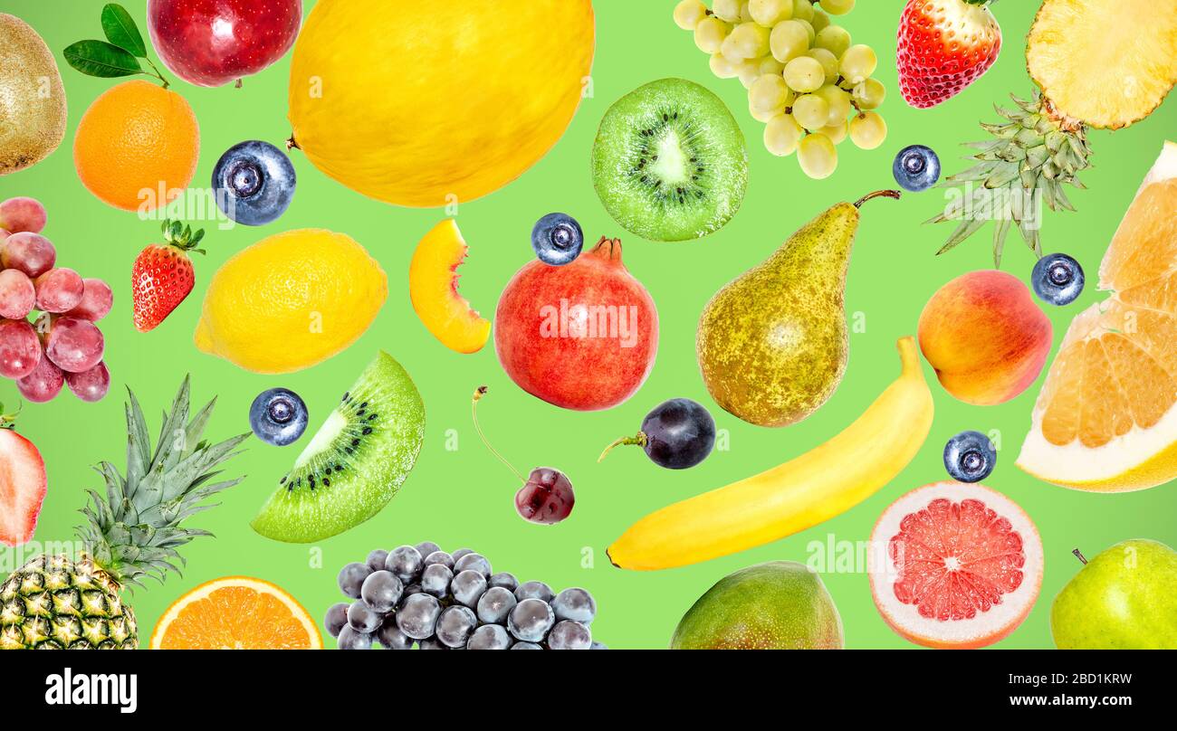 Creative photo of many different exotic tropical bright fruits on a ...