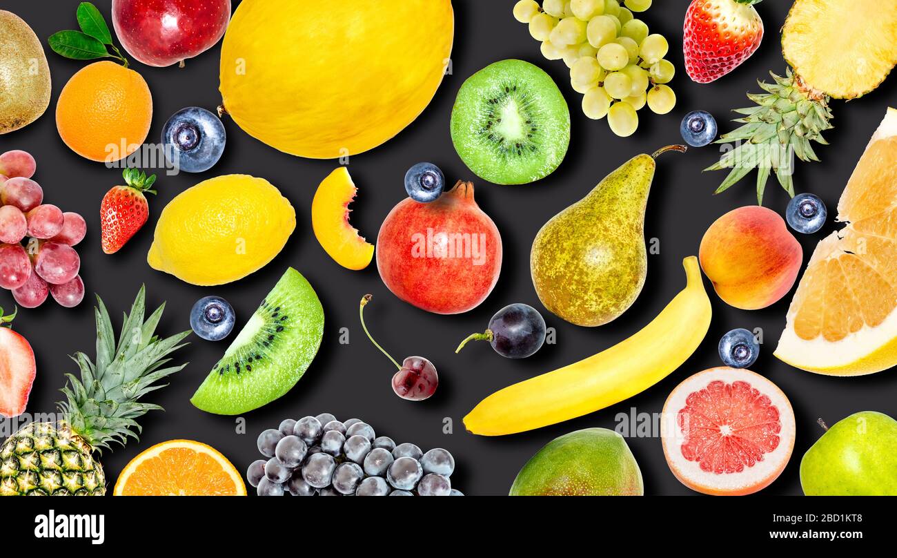 Creative photo of many different exotic tropical bright fruits with ...