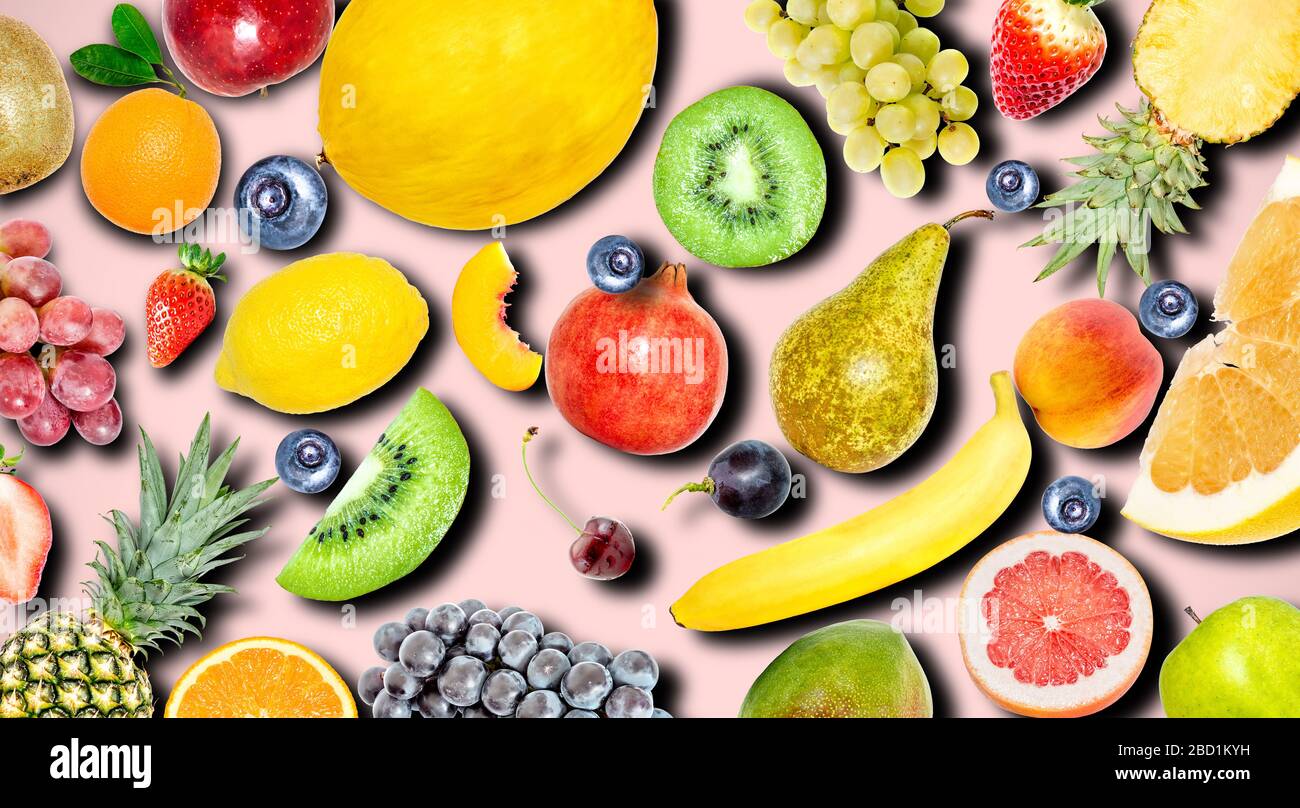 Creative photo of many different exotic tropical bright fruits with ...