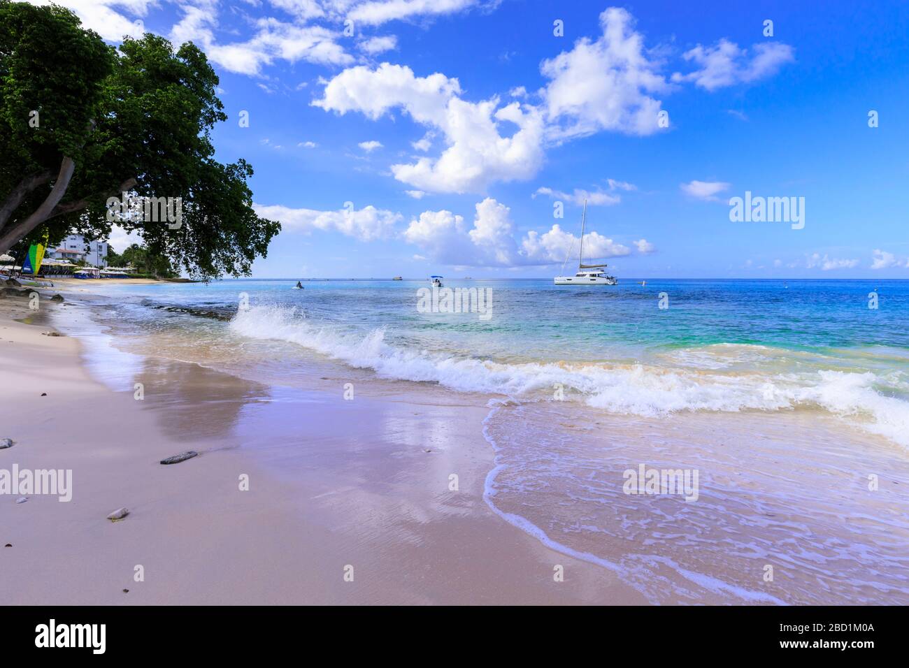 Paynes Bay, small boats off fine pale pink sand beach, turquoise sea ...