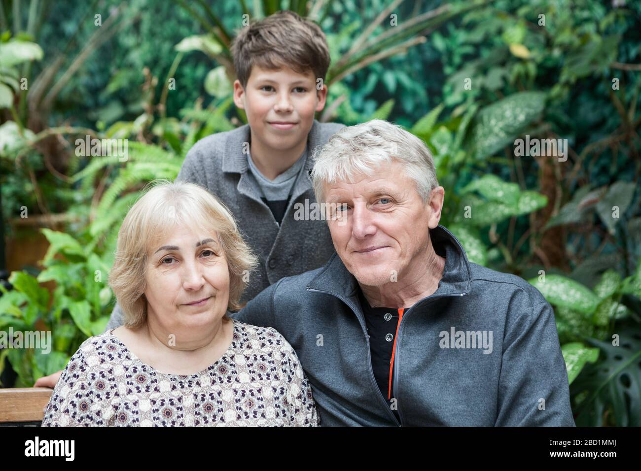 Portrait of grandpa and grandma with their grandson, Caucasian people ...