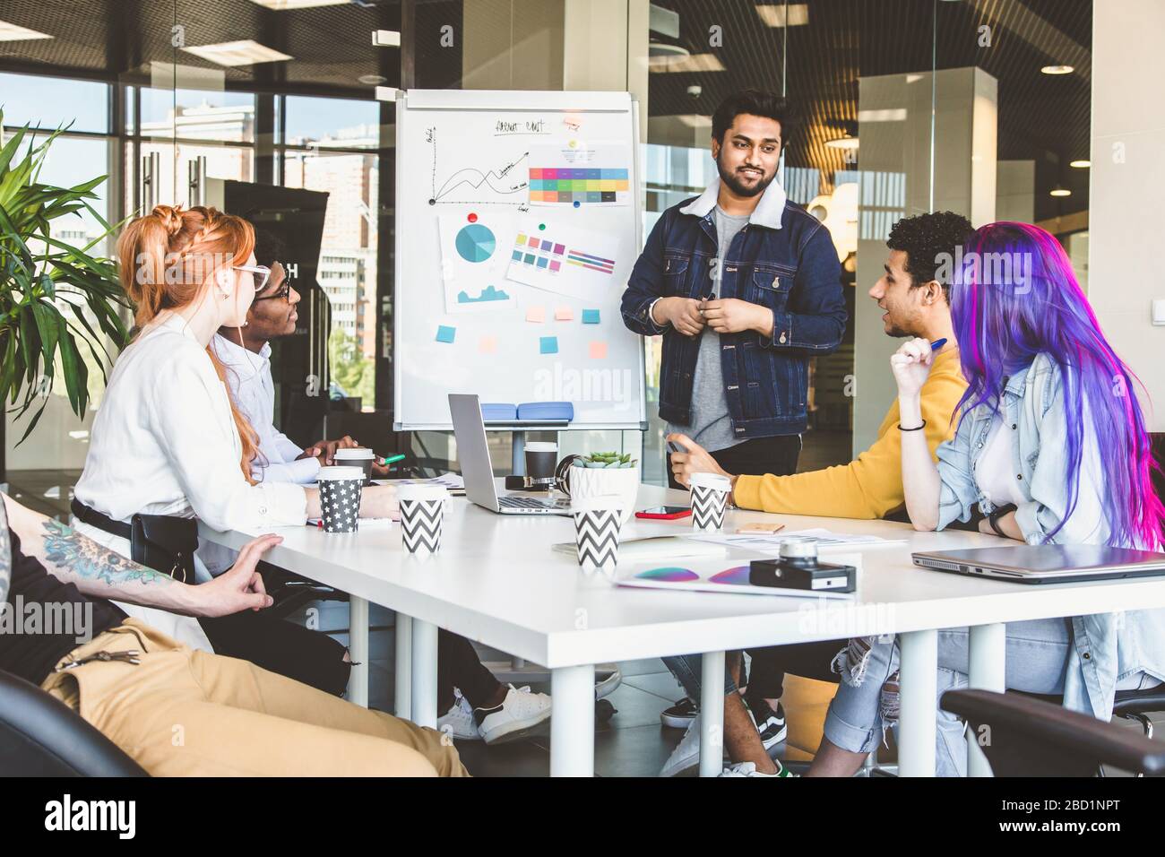Group of multi ethnic executives discussing during a meeting. Business ...