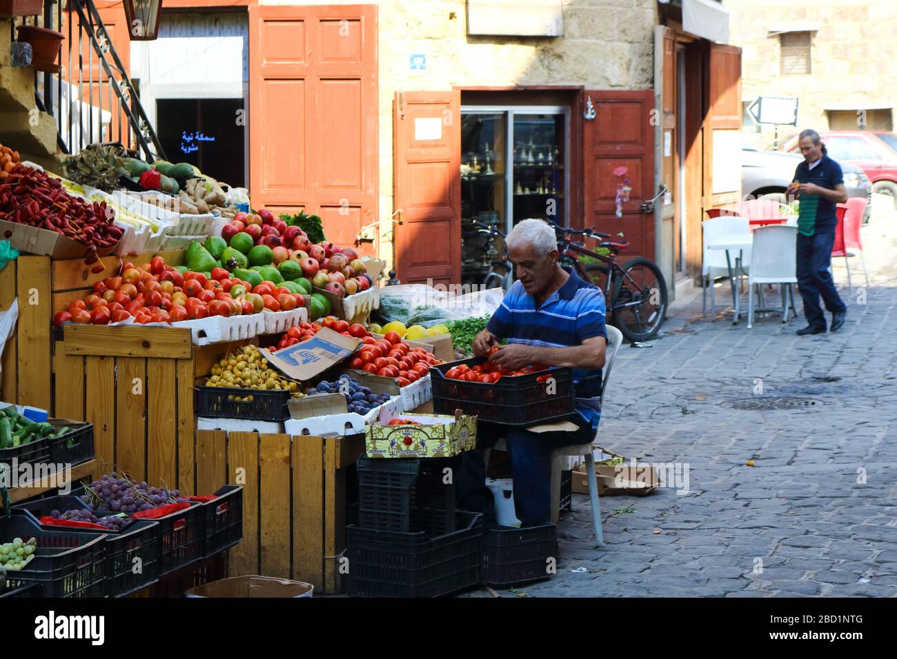 Batroun, Lebanon - October 15, 2017: Shopkeeper sitting in front of his ...