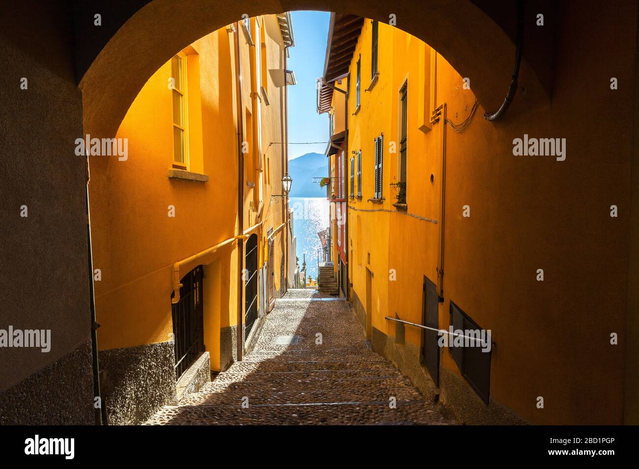 Colourful narrow alley in the old town of Varenna, Lake Como, Lombardy ...