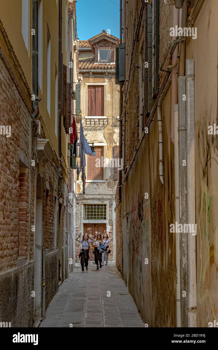 Children running alleyway hi-res stock photography and images - Alamy