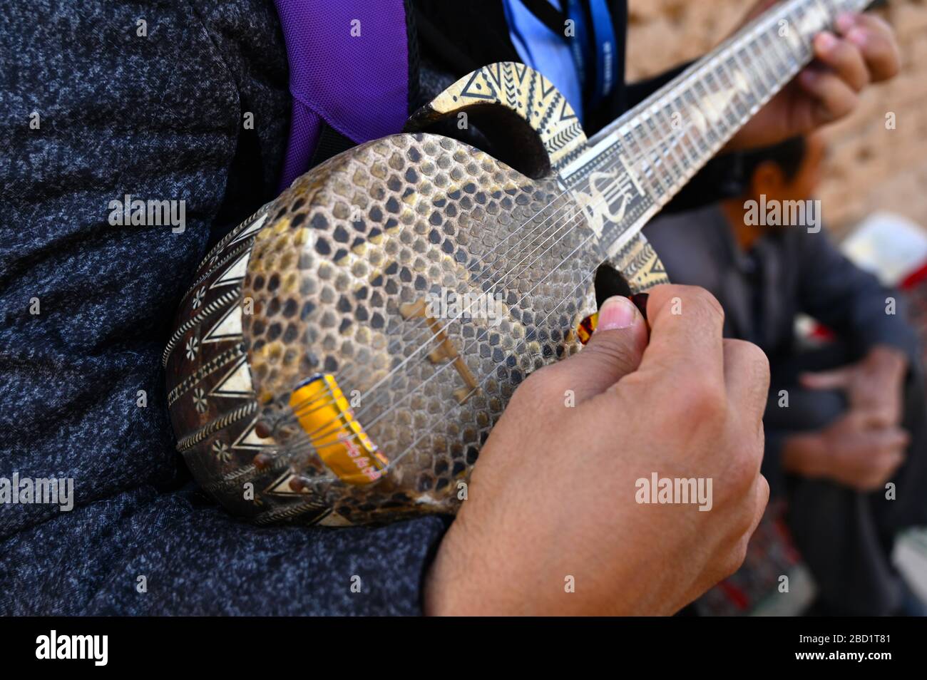 Rawap, the traditional decorated Uyghur lute covered in snakeskin ...