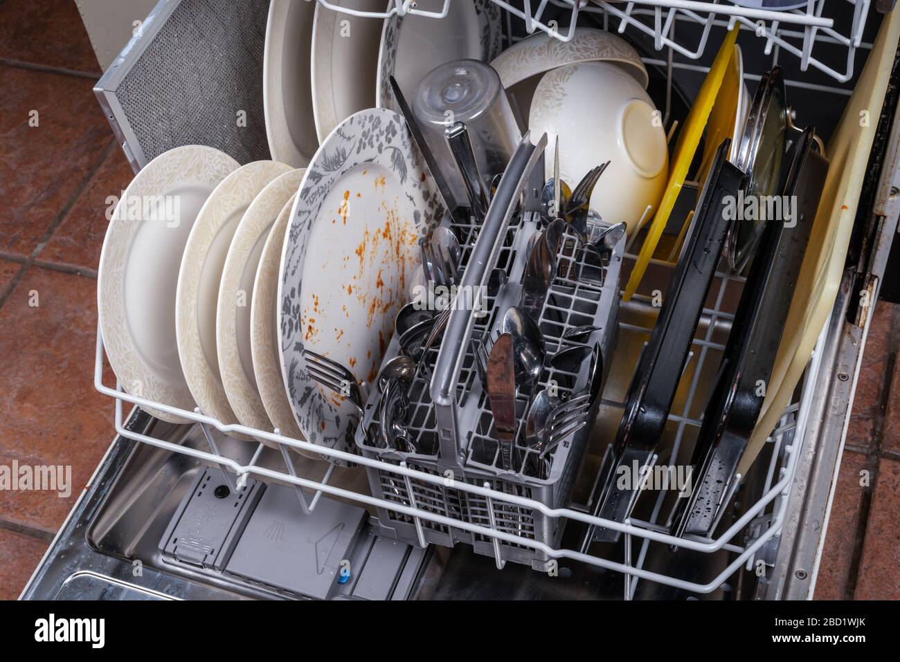 A dishwasher loaded with dirty dishes Stock Photo - Alamy