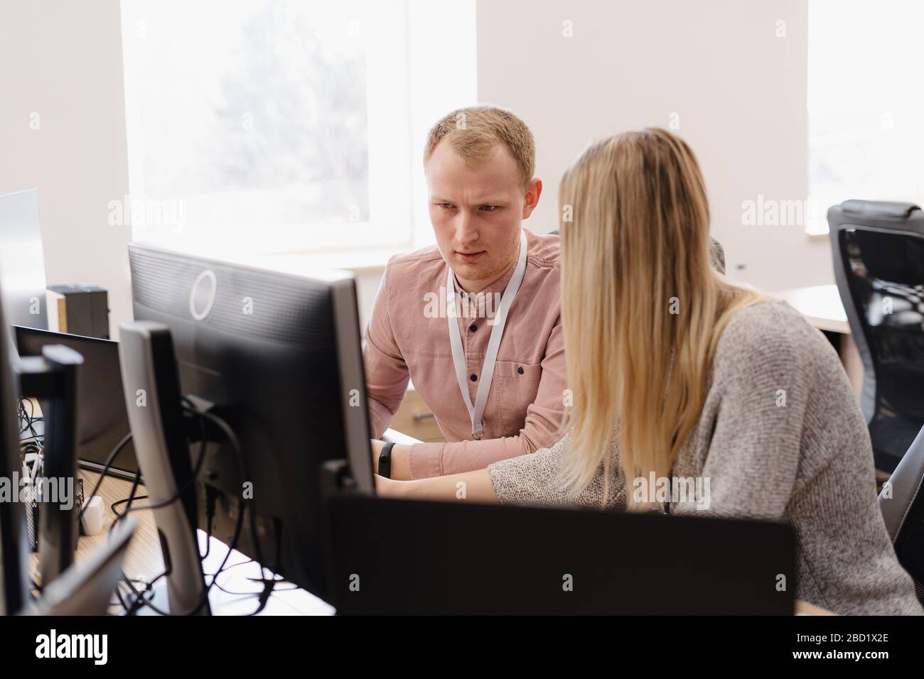 Full concentration at work. Group of young business people working and ...