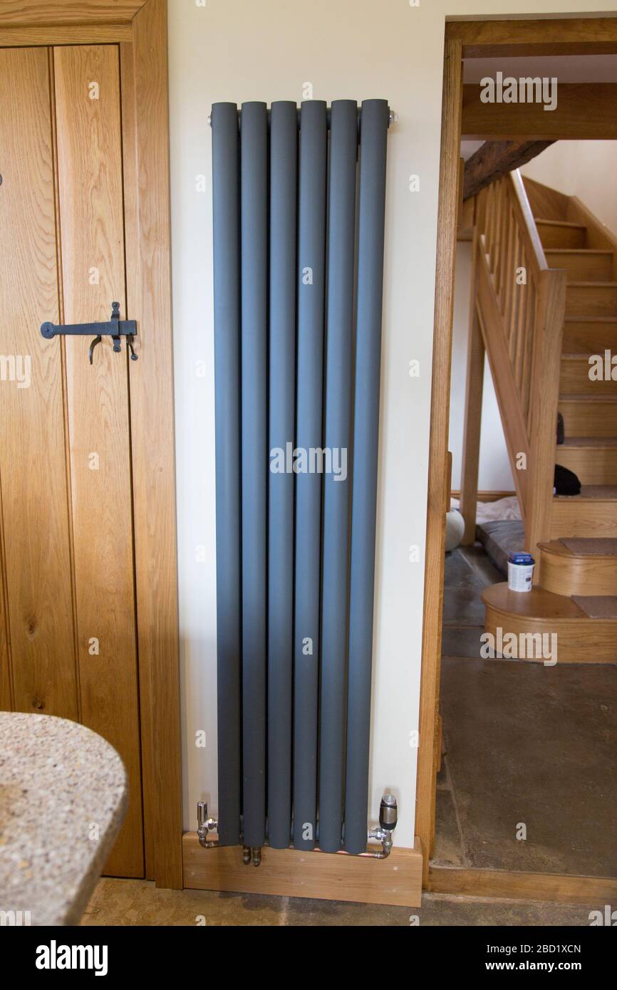 Vertical Radiator on kitchen wall, dark grey vertical radiator in a ...