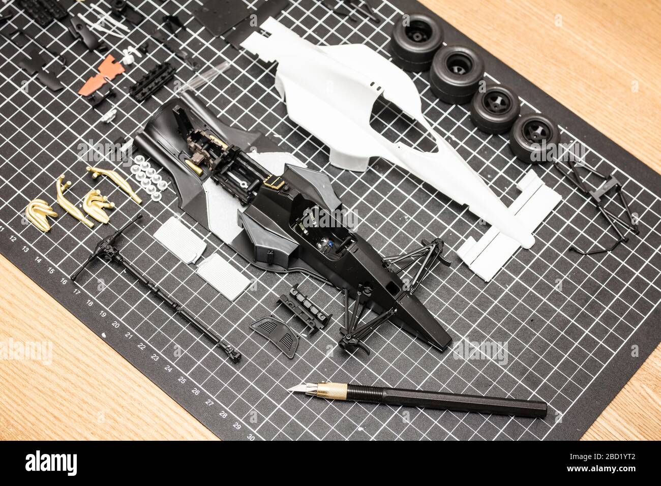 Toy Model Car Parts On A Desk Stock Photo - Alamy