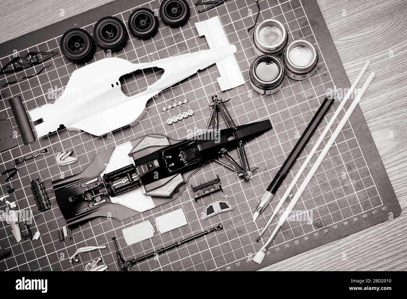 Toy Model Car Parts On A Desk Stock Photo - Alamy