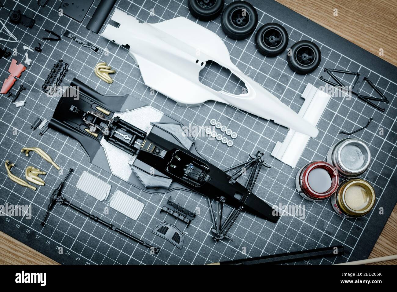 Toy Model Car Parts On A Desk Stock Photo - Alamy