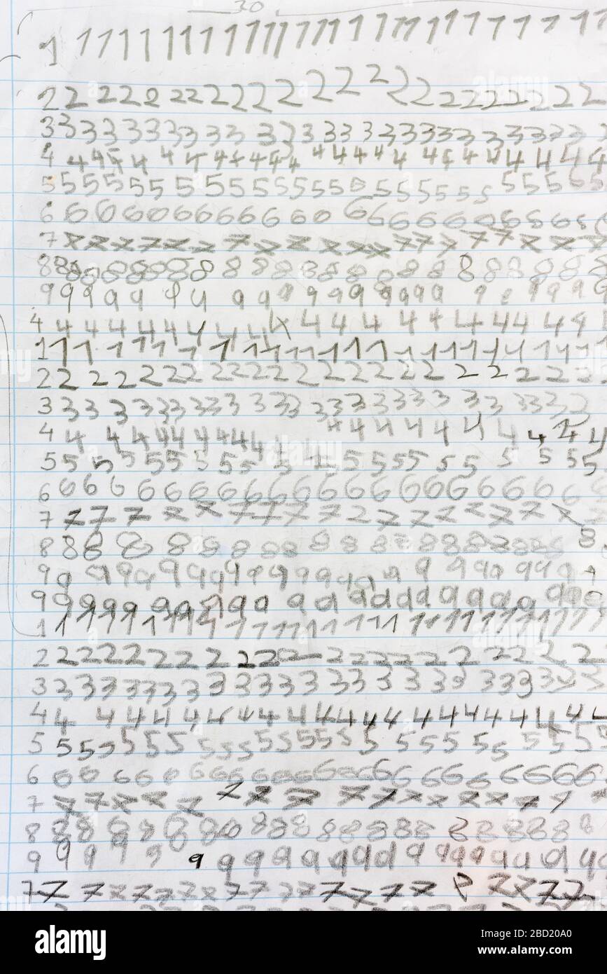 Numbers written by a child repeated on the sheet of paper notebook at ...