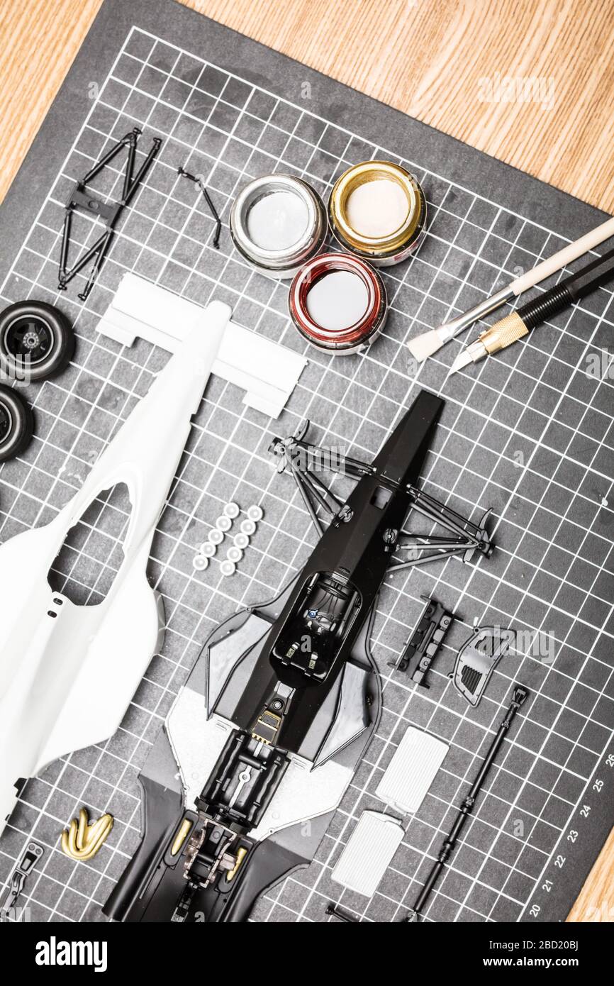 Toy Model Car Parts On A Desk Stock Photo - Alamy