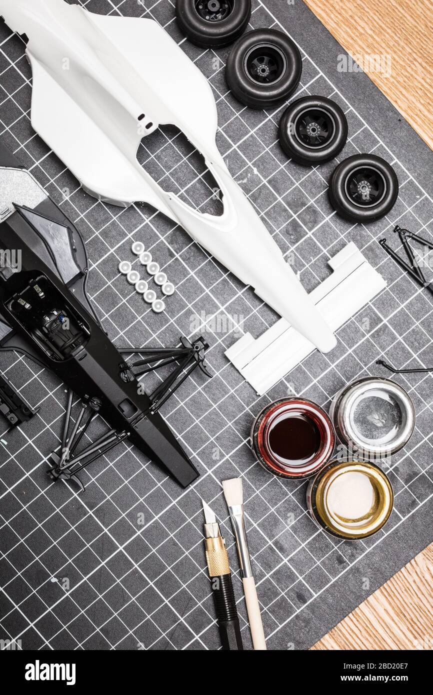 Toy Model Car Parts On A Desk Stock Photo - Alamy