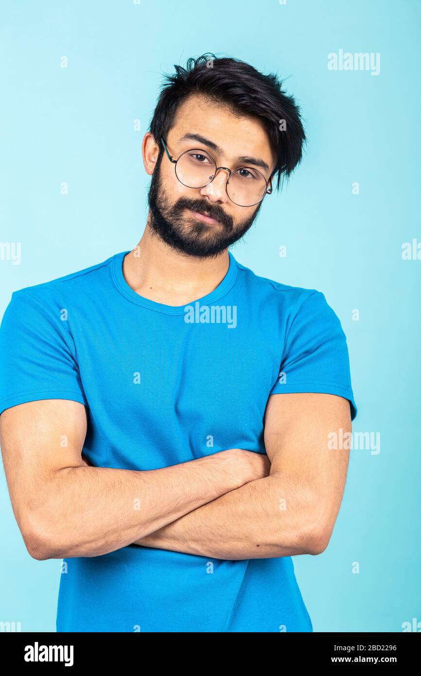 Emotional portrait of a handsome Hindu man in a blue T-shirt on a ...