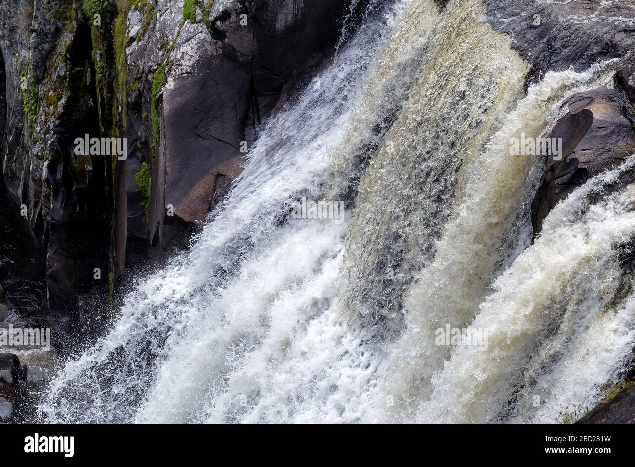 Closeup of waterfall. Powerful waterfall falling forcefully ...