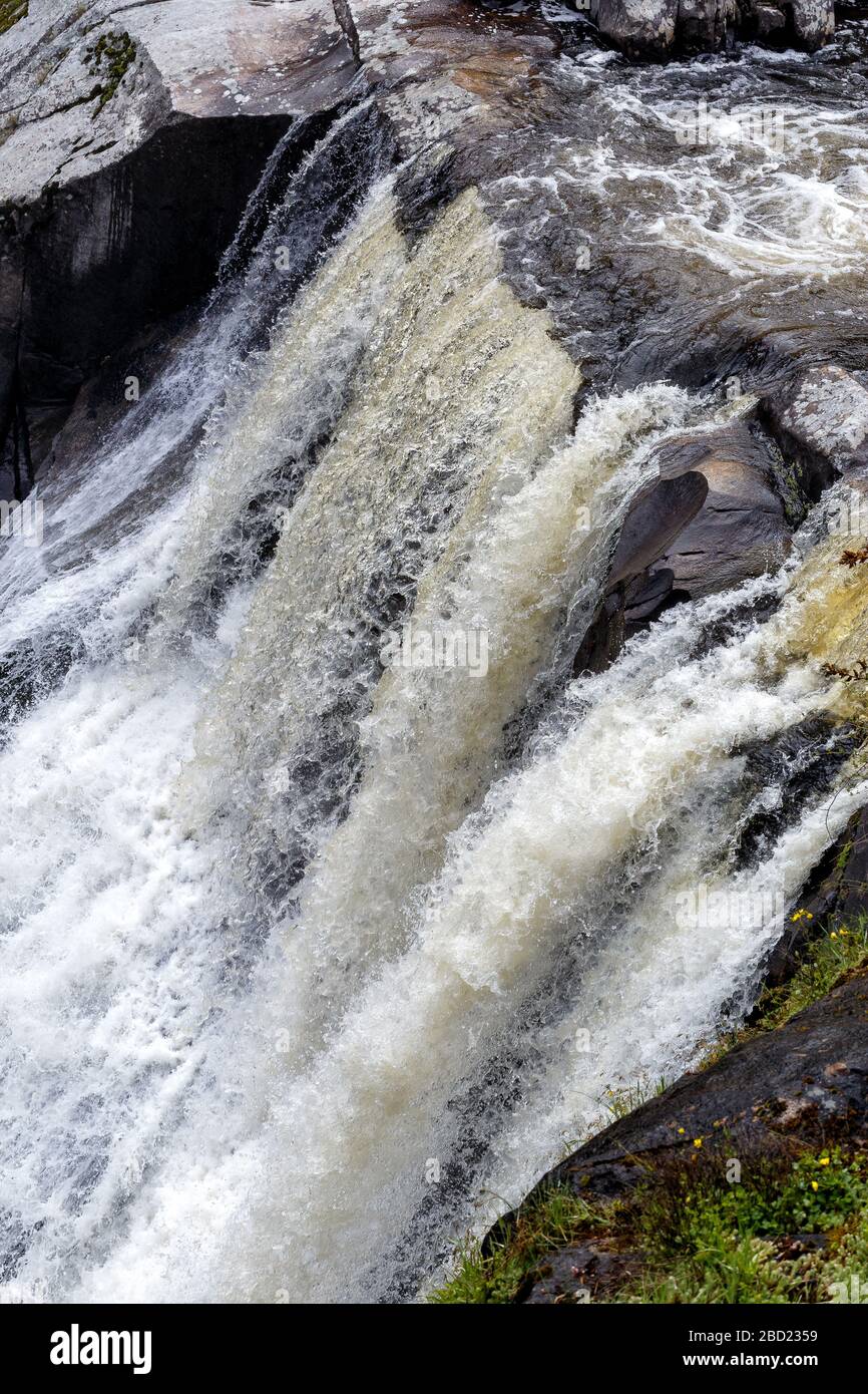 Closeup of waterfall. Powerful waterfall falling forcefully ...