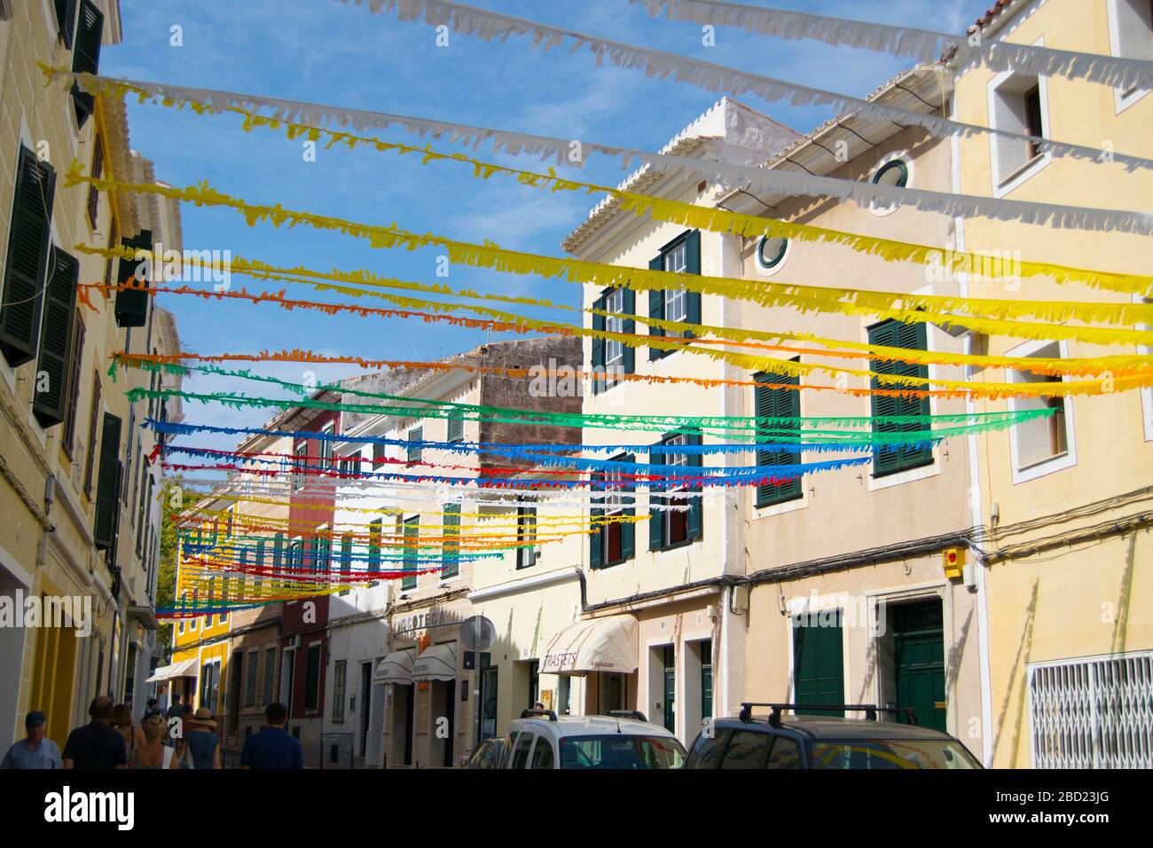 Colourful bunting above a street in Mahón Stock Photo - Alamy