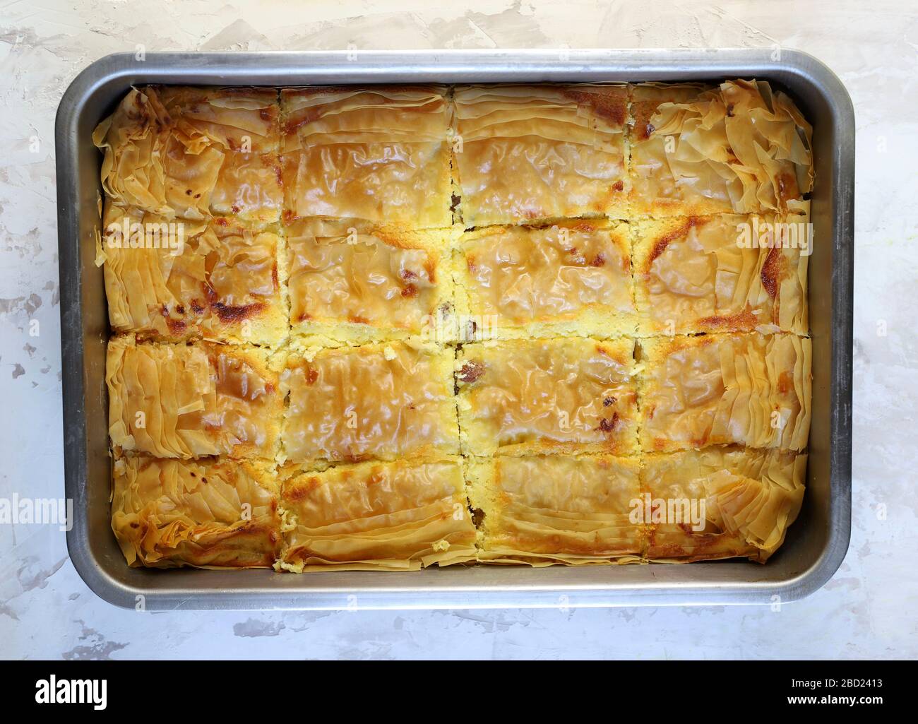 Concept of Greek cuisine. Homemade traditional greek Bougatsa, phyllo ...
