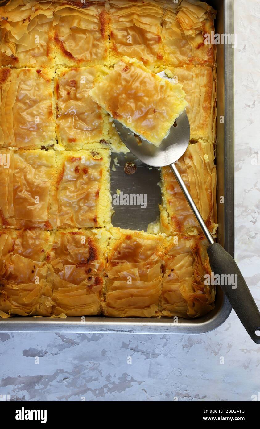 Concept of Greek cuisine. Homemade traditional greek Bougatsa, phyllo ...