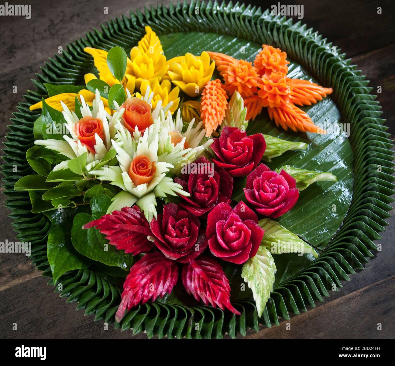 Table decoration: Edible flowers carved from brightly colored ...