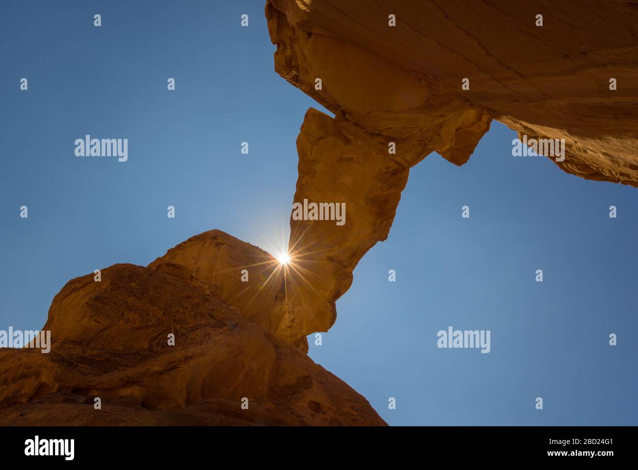 Large stone bridge in Wadi Rum desert illuminated by sun. Successfully ...