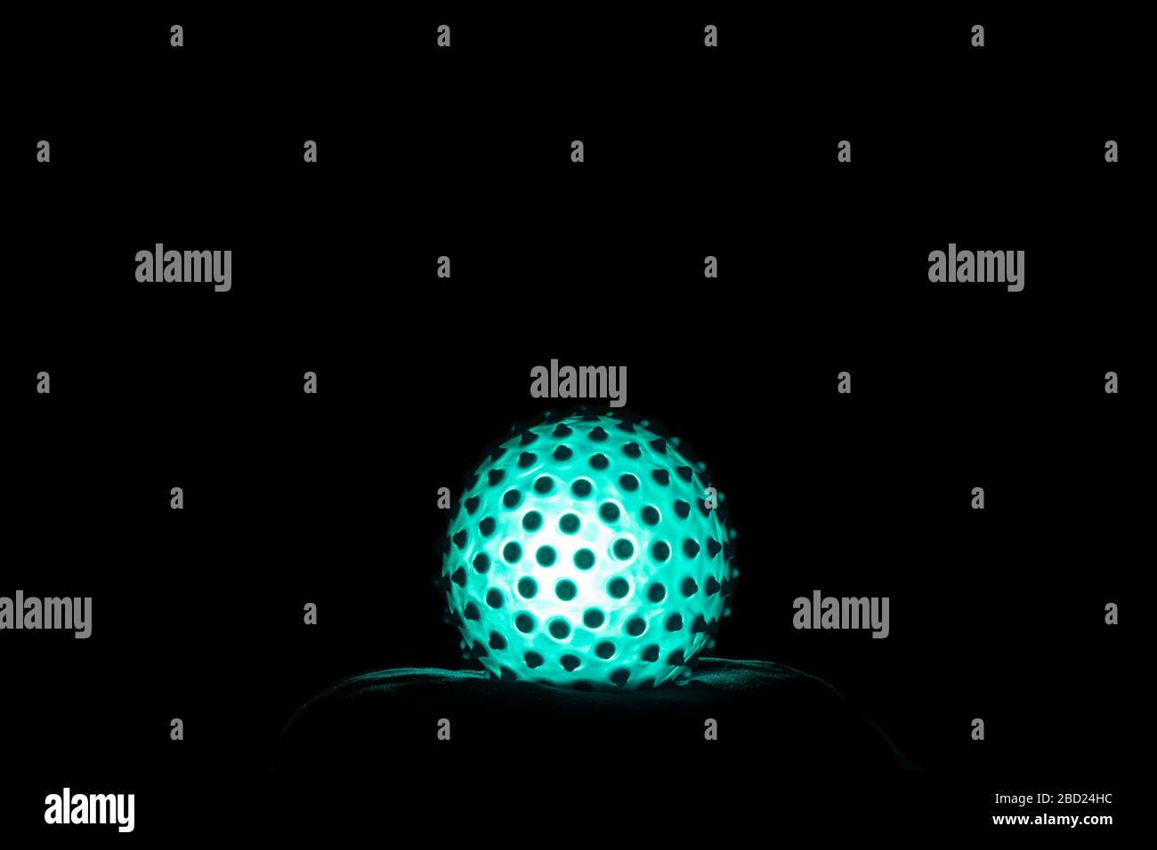 representation of a virus using an illuminated sphere with a black ...