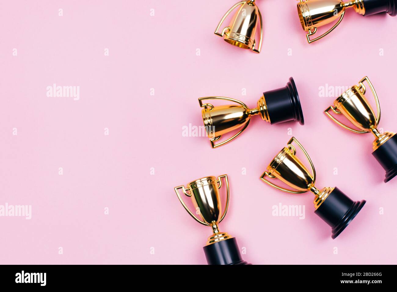 Winner cups on a pink background. Banner with a place for text. Flat ...