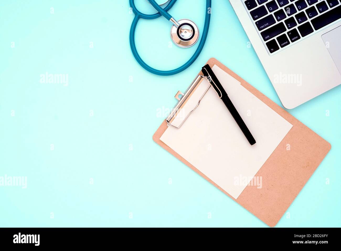 Vintage Stethoscope doctor equipment mockup on flat blue table top view ...