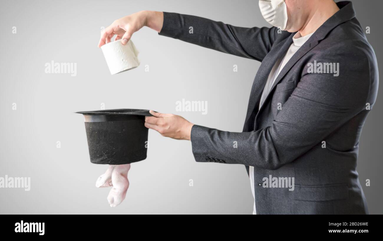 Man is taking a toilet paper from a hat like a wizard. Concept photo of ...