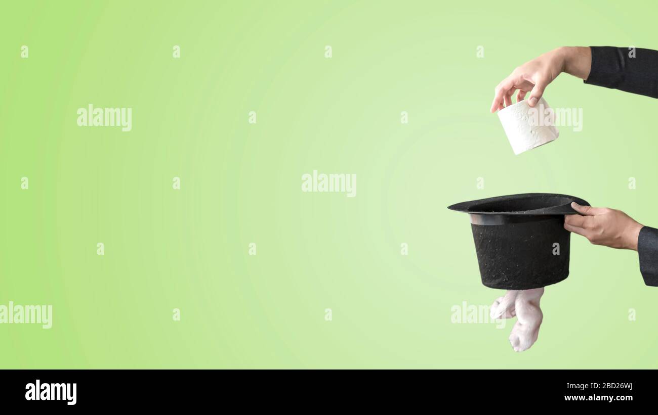 Man is taking a toilet paper from a hat like a wizard. Concept photo of ...