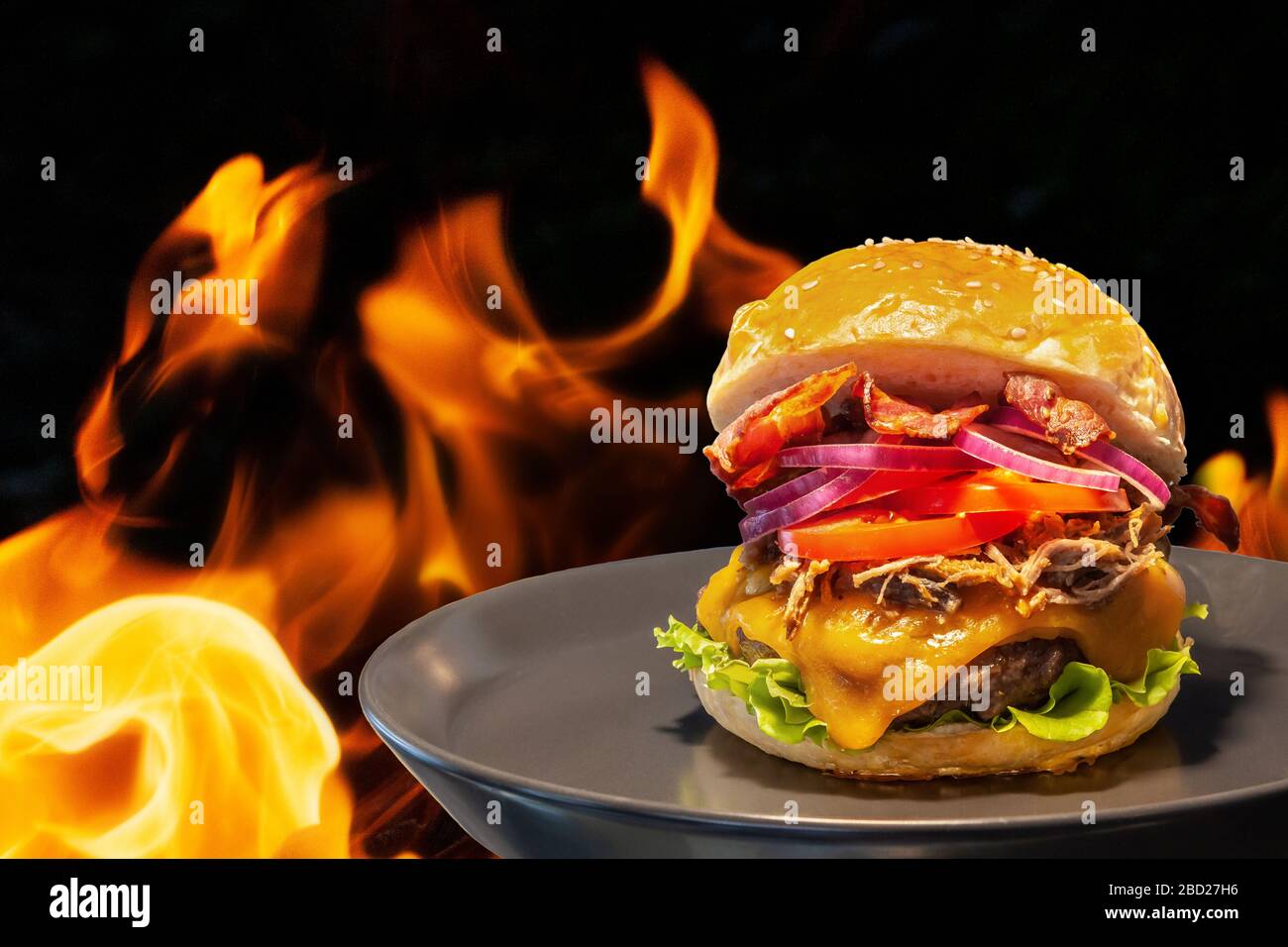 Close-up of home made burgers with fire flames Stock Photo - Alamy