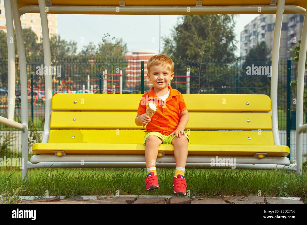 outdoor portrait of a little boy. child eating ice cream Stock Photo ...