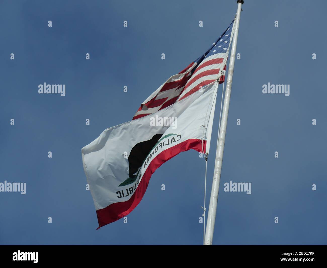 State of California flag flying from a pole, cropped shot Stock Photo ...