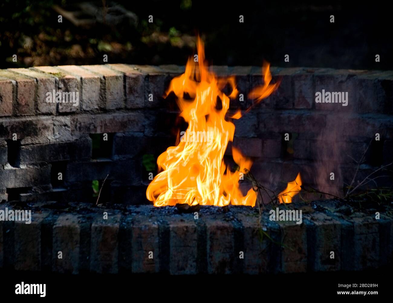 A fire in a burn pit Stock Photo - Alamy
