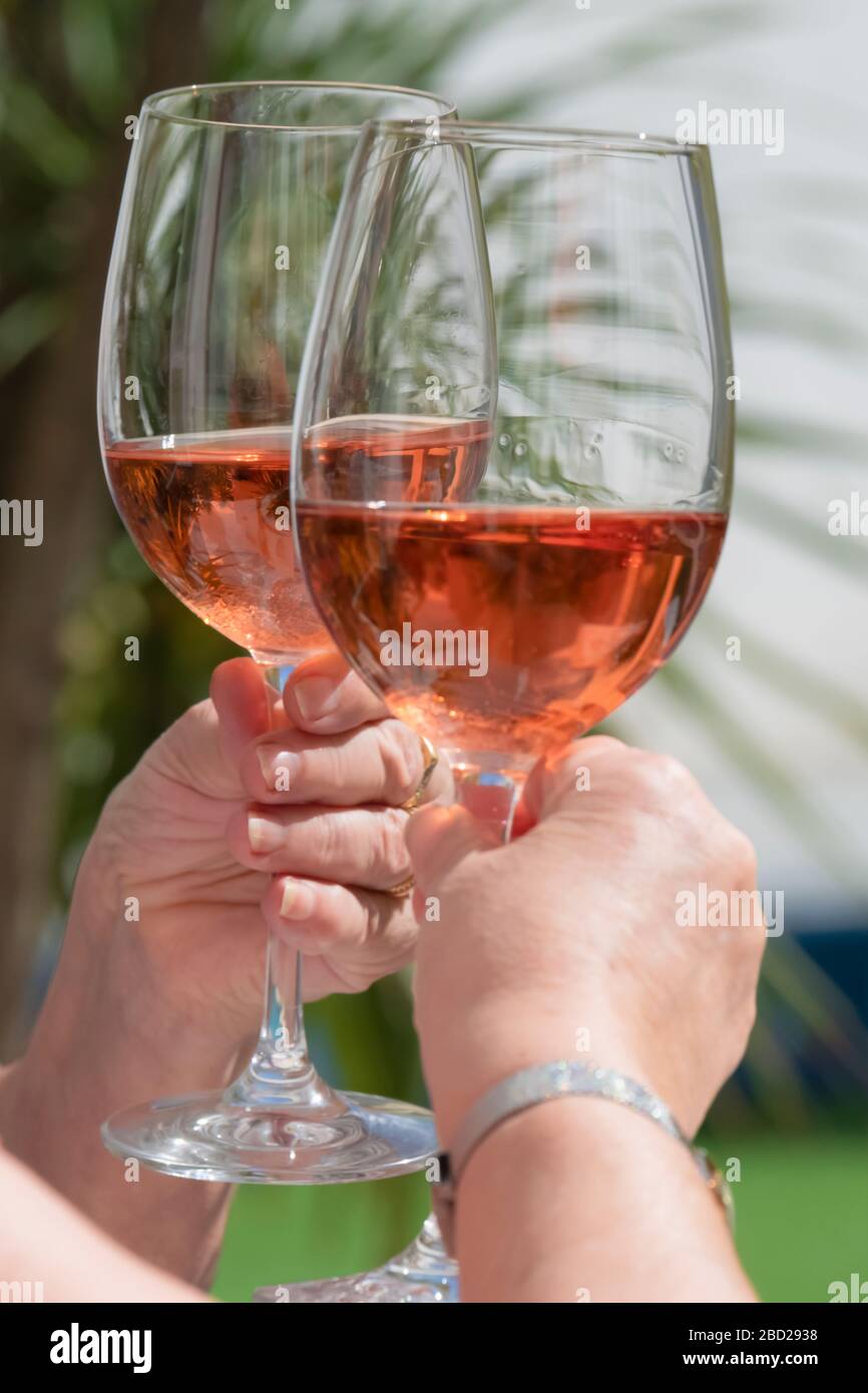Male female hands clink wine hi-res stock photography and images - Alamy