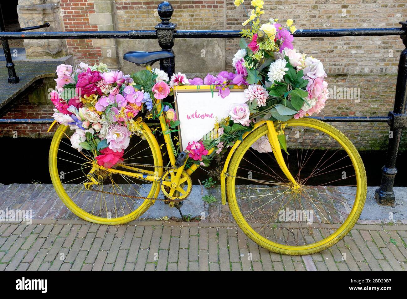 Old-fashioned Dutch city bike near a bridge over canal in the Old Town ...