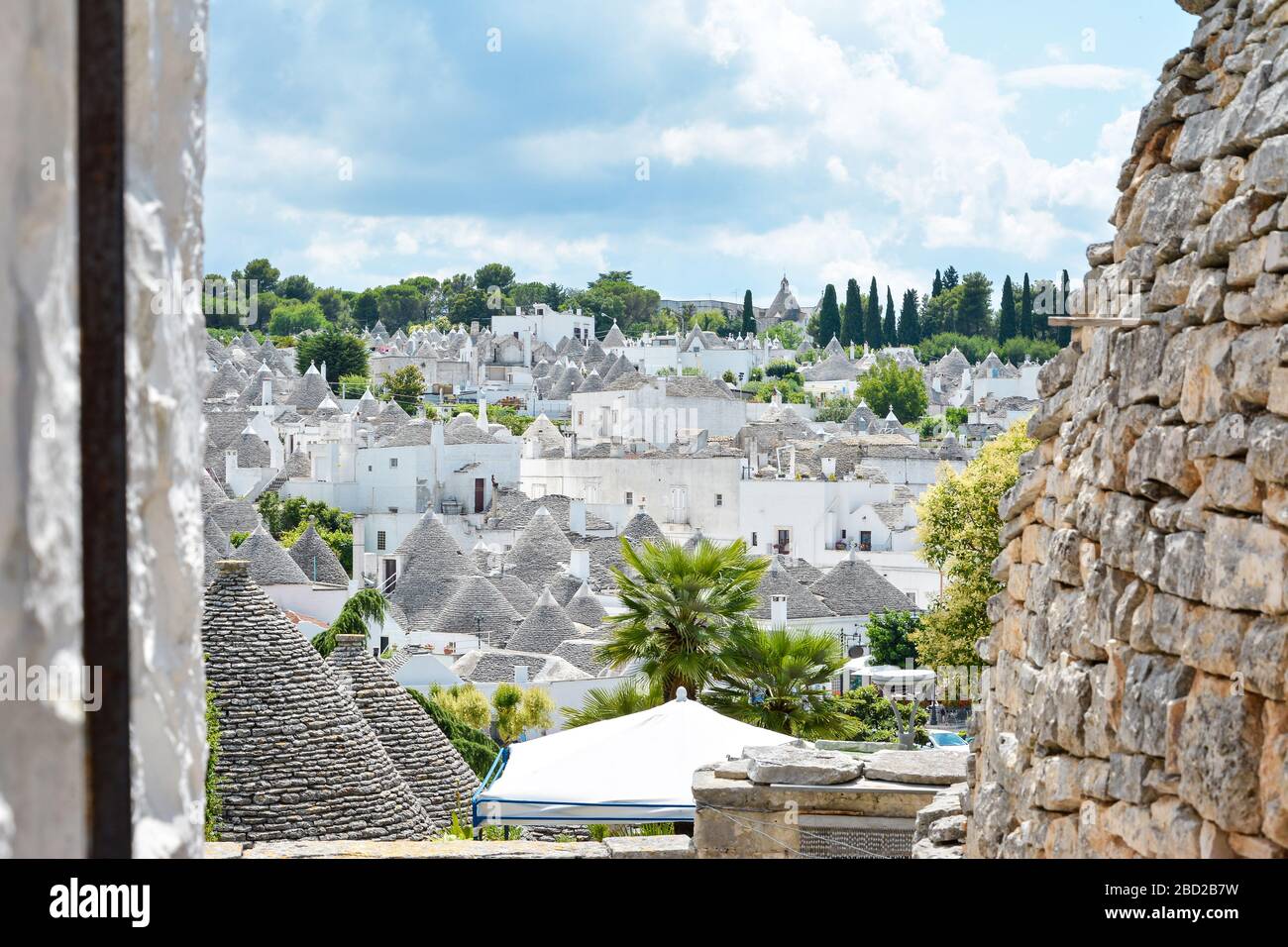 Scenic panoramic view of Alberobello town and its typical trulli ...