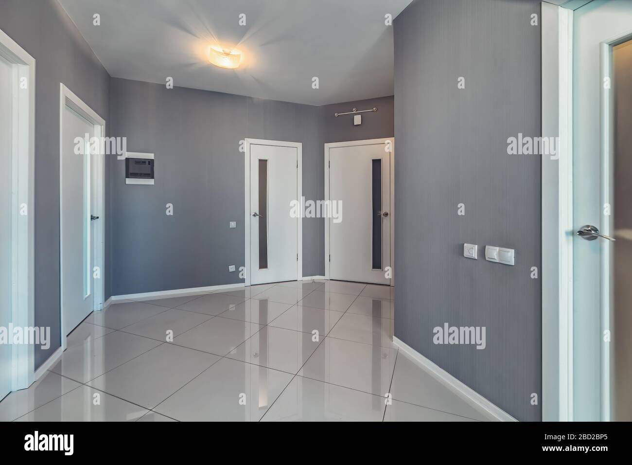 Empty residential house entrance with closed wooden doors tiny hallway ...