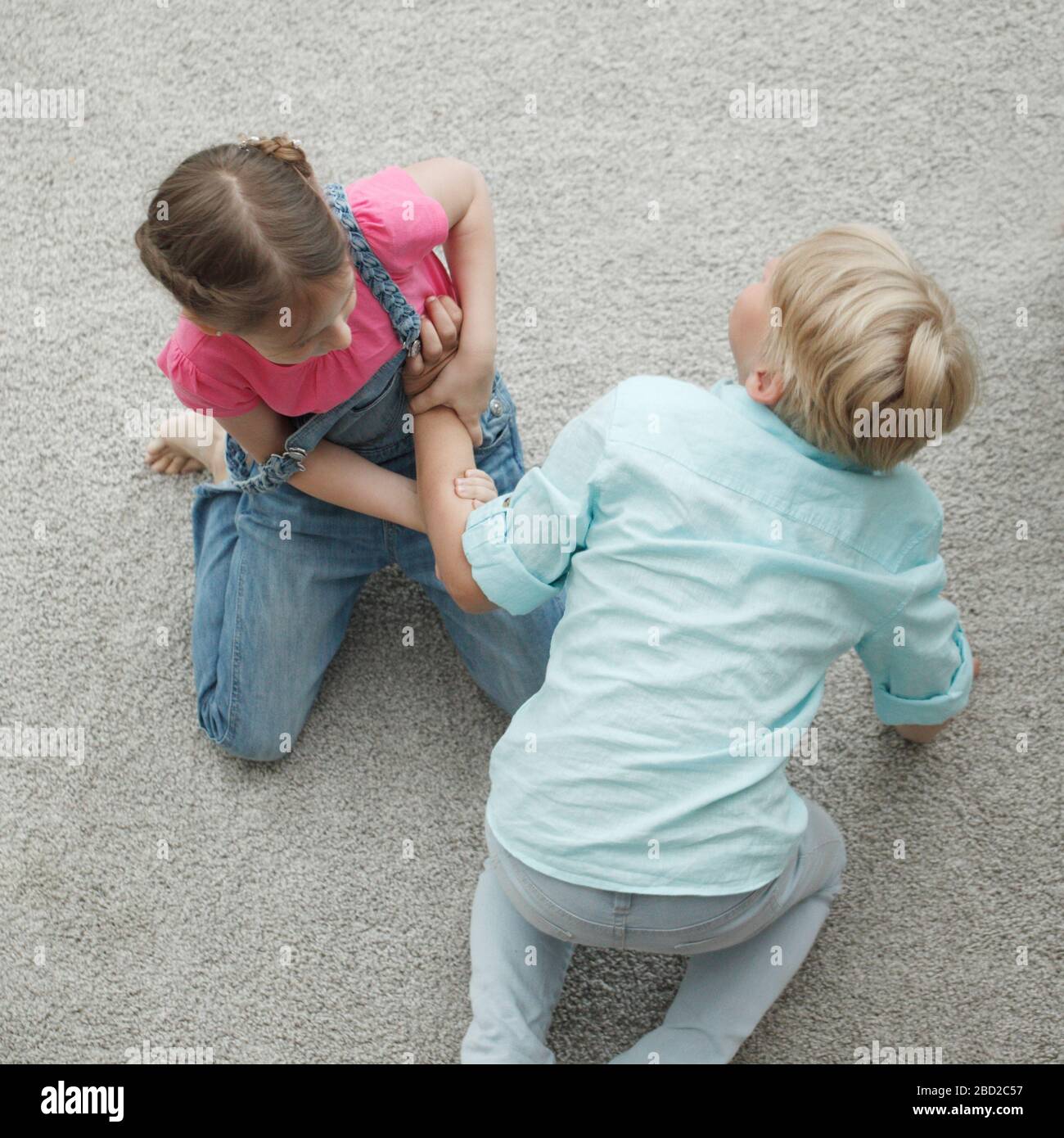 Struggle between two children conflict fighting family concept Stock ...