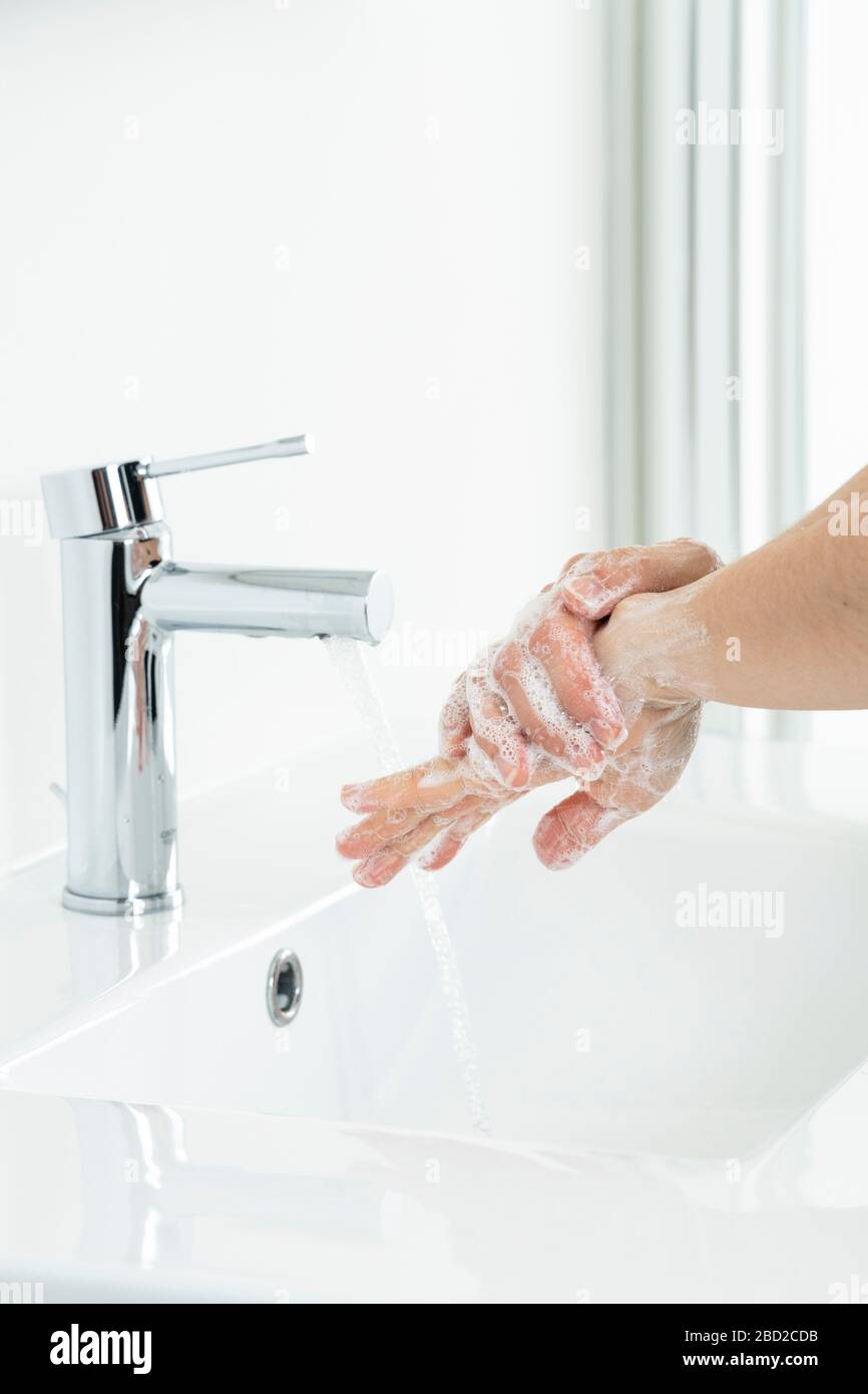 Hand washing soap under running hi-res stock photography and images - Alamy